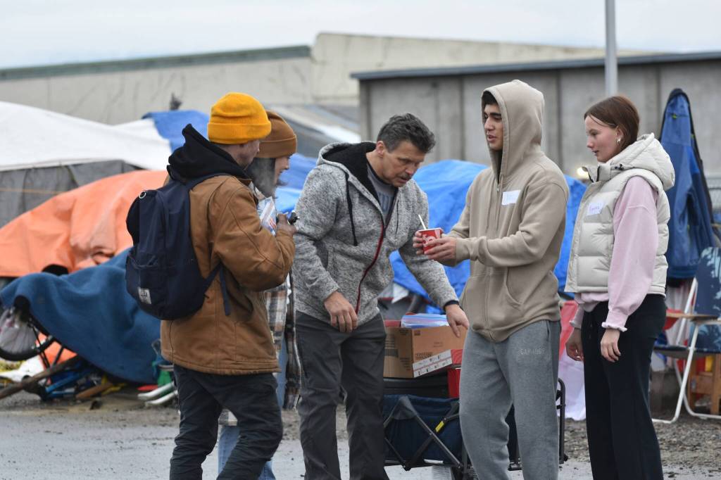 PHOTOS: Care packages bring bright smiles to rainy Kelowna tent city ...
